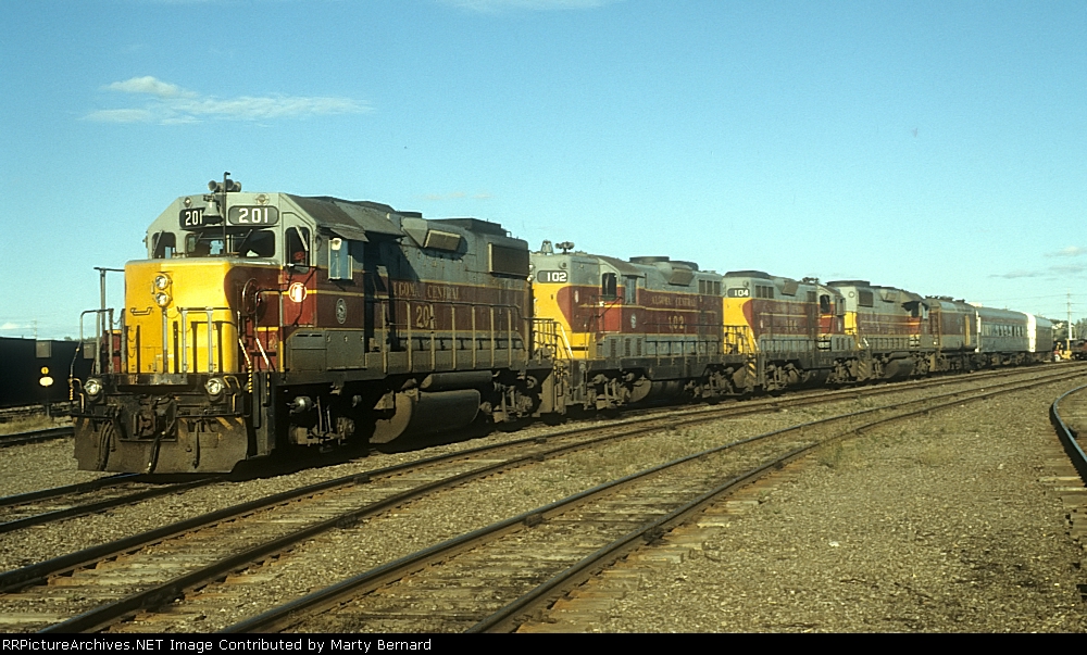 Two GP7s Sandwiched by Two GP38s and What Looks Like a Steam Generator Car Made Out of a Steam ...